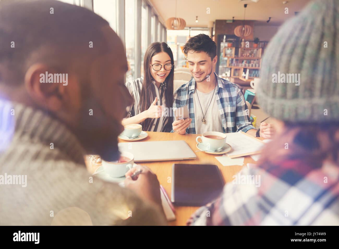 Positive students having lunch together Stock Photo - Alamy