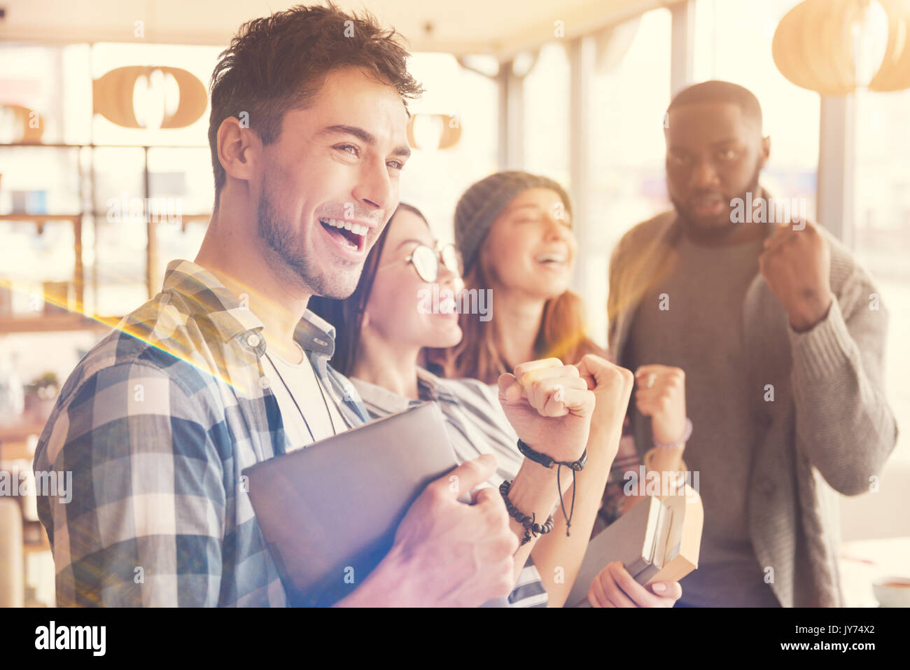 Overjoyed students being delighted with result Stock Photo - Alamy