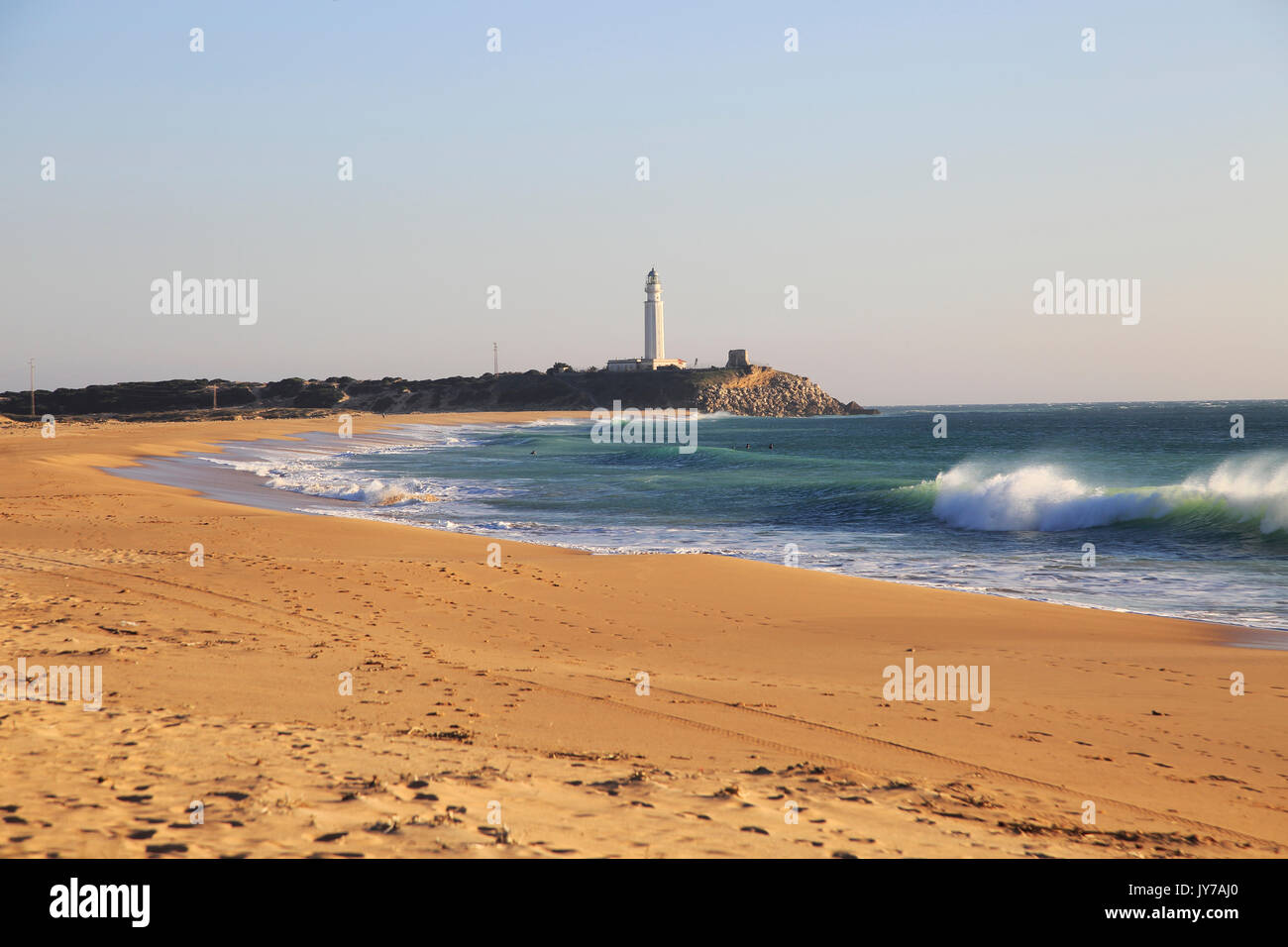 Sandy beach and lighthouse at Cabo de Trafalgar, Cape Trafalgar, Cadiz ...