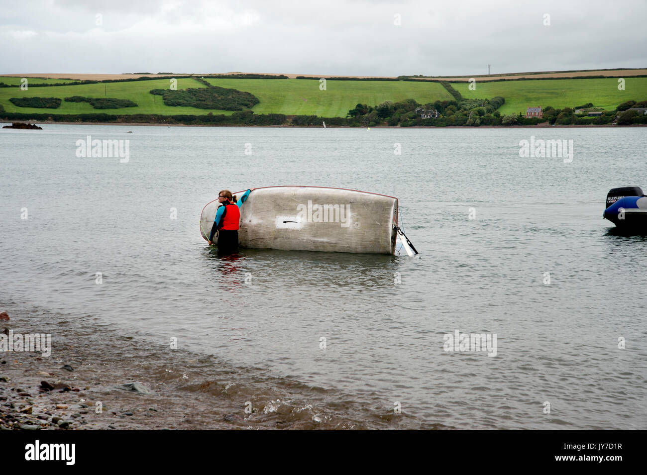 Dale, West Wales. Capsized dingy Stock Photo - Alamy