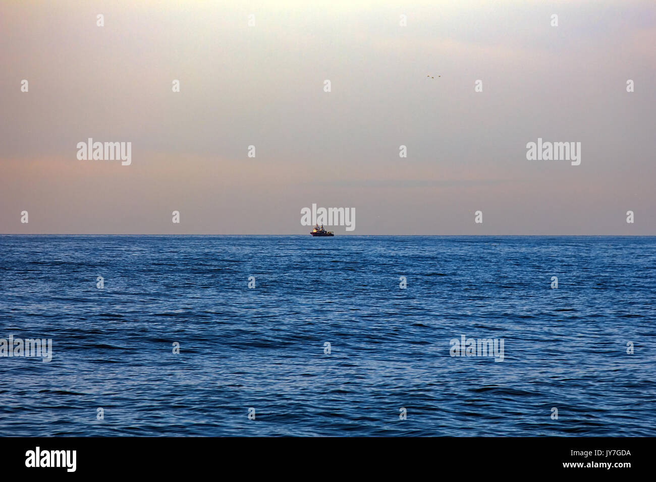 commercial catch fishing far out at sea. ship trawler nets fishing ...
