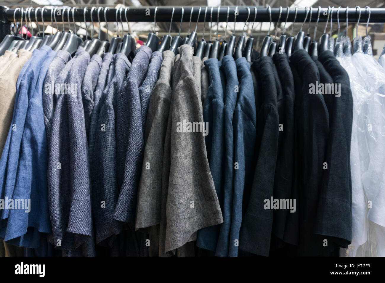 Row of clothes on a rail Stock Photo - Alamy