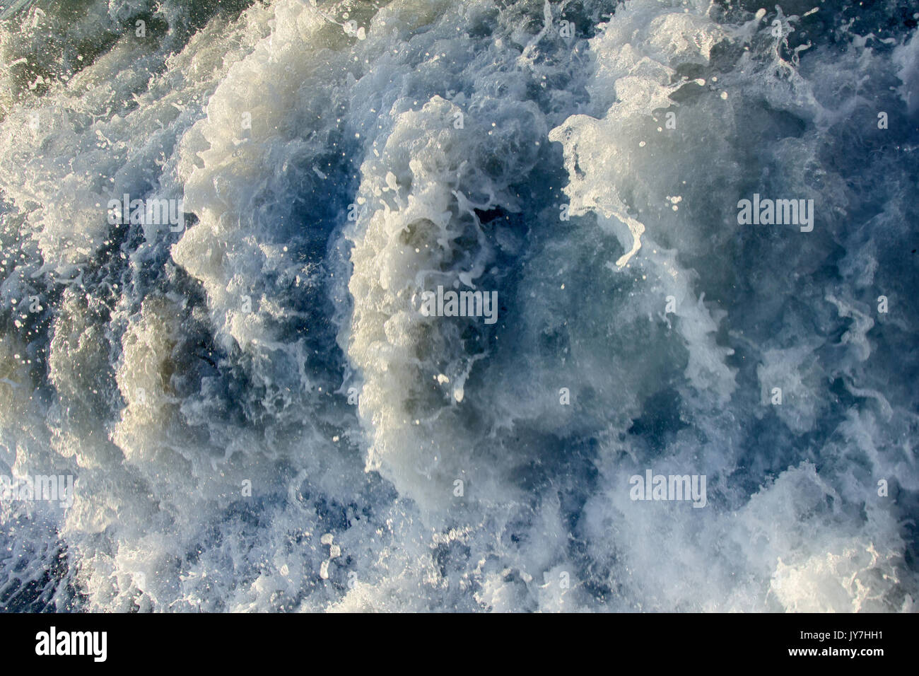raging sea water at beach. forces of nature in performance of waves of ...