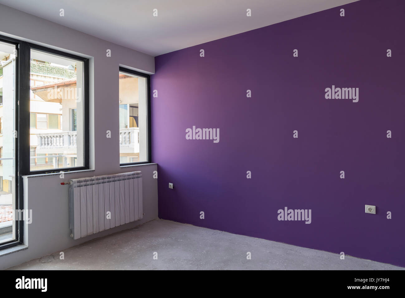 Unfinished interior of apartment under construction with gray concrete ...