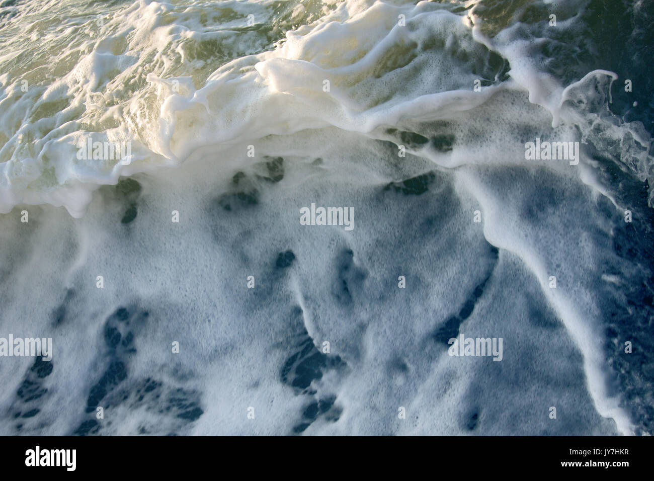 raging sea water at beach. forces of nature in performance of waves of ...