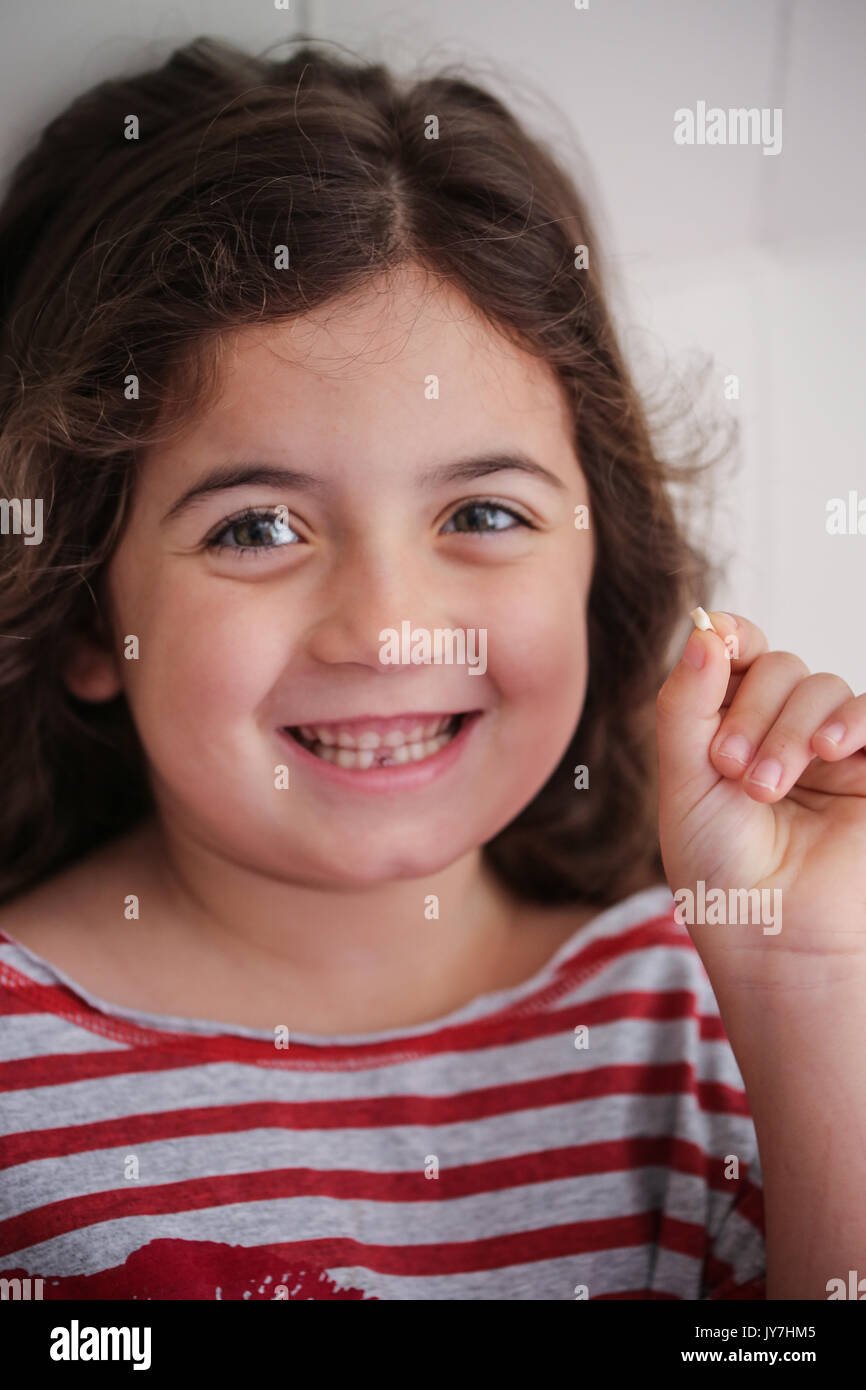 My tooth is loose! The First Loose Tooth Stock Photo - Alamy