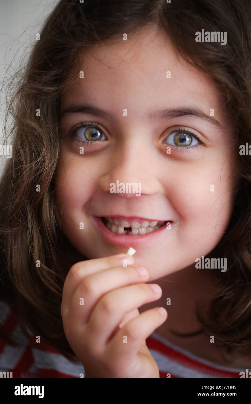 My tooth is loose! The First Loose Tooth Stock Photo - Alamy