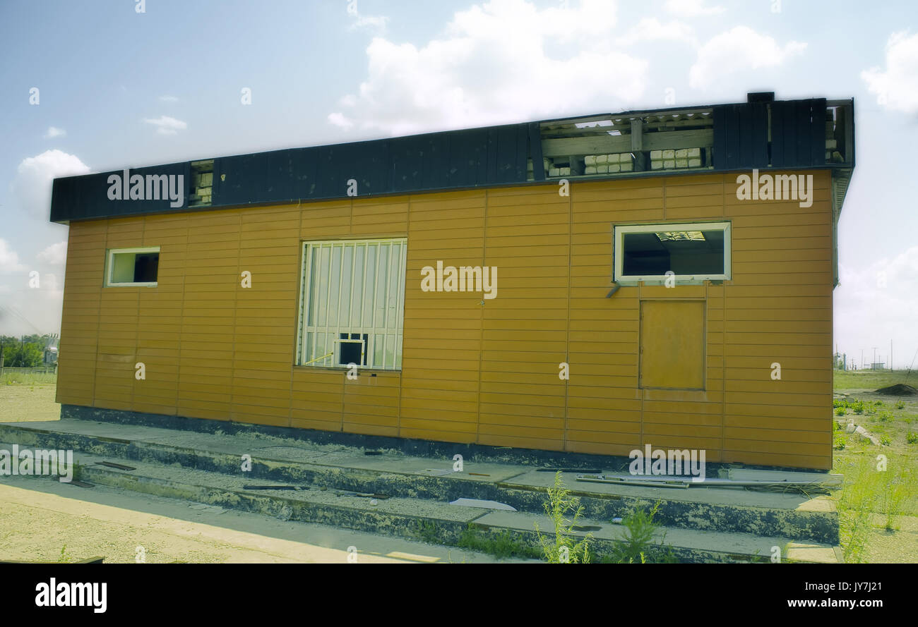 Abandoned doghouse, shack, house trailer, module on the side of the ...