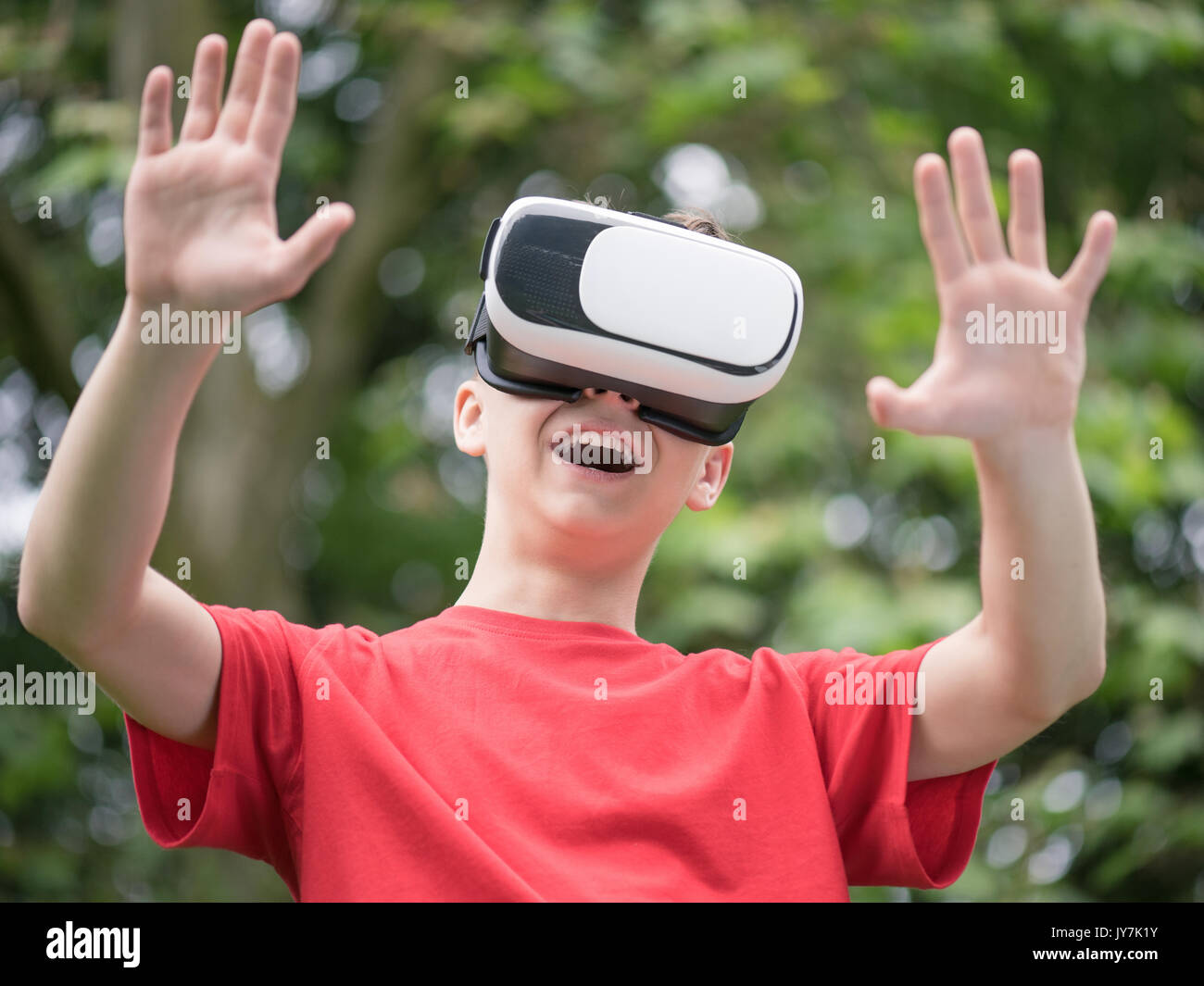 Teen boy with VR glasses Stock Photo - Alamy