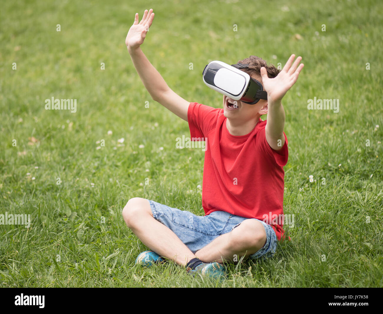 Teen boy with VR glasses Stock Photo - Alamy