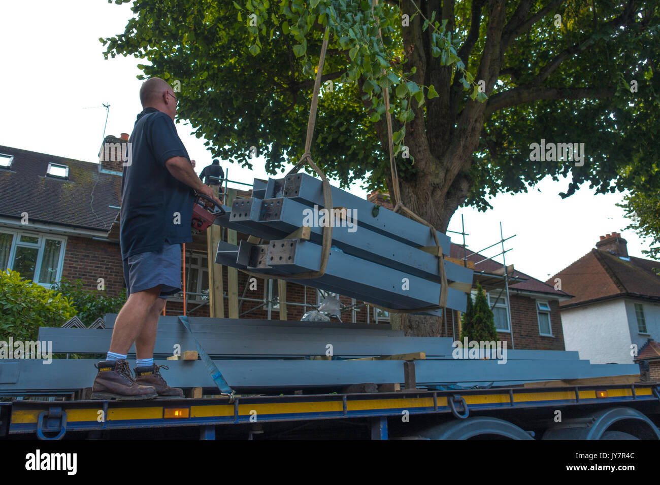 Delivery of building supplies using crane on a lorry Stock Photo - Alamy