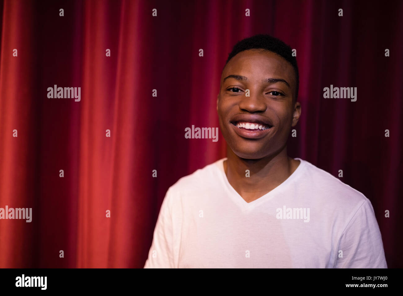 Portrait of actor standing on the stage Stock Photo - Alamy