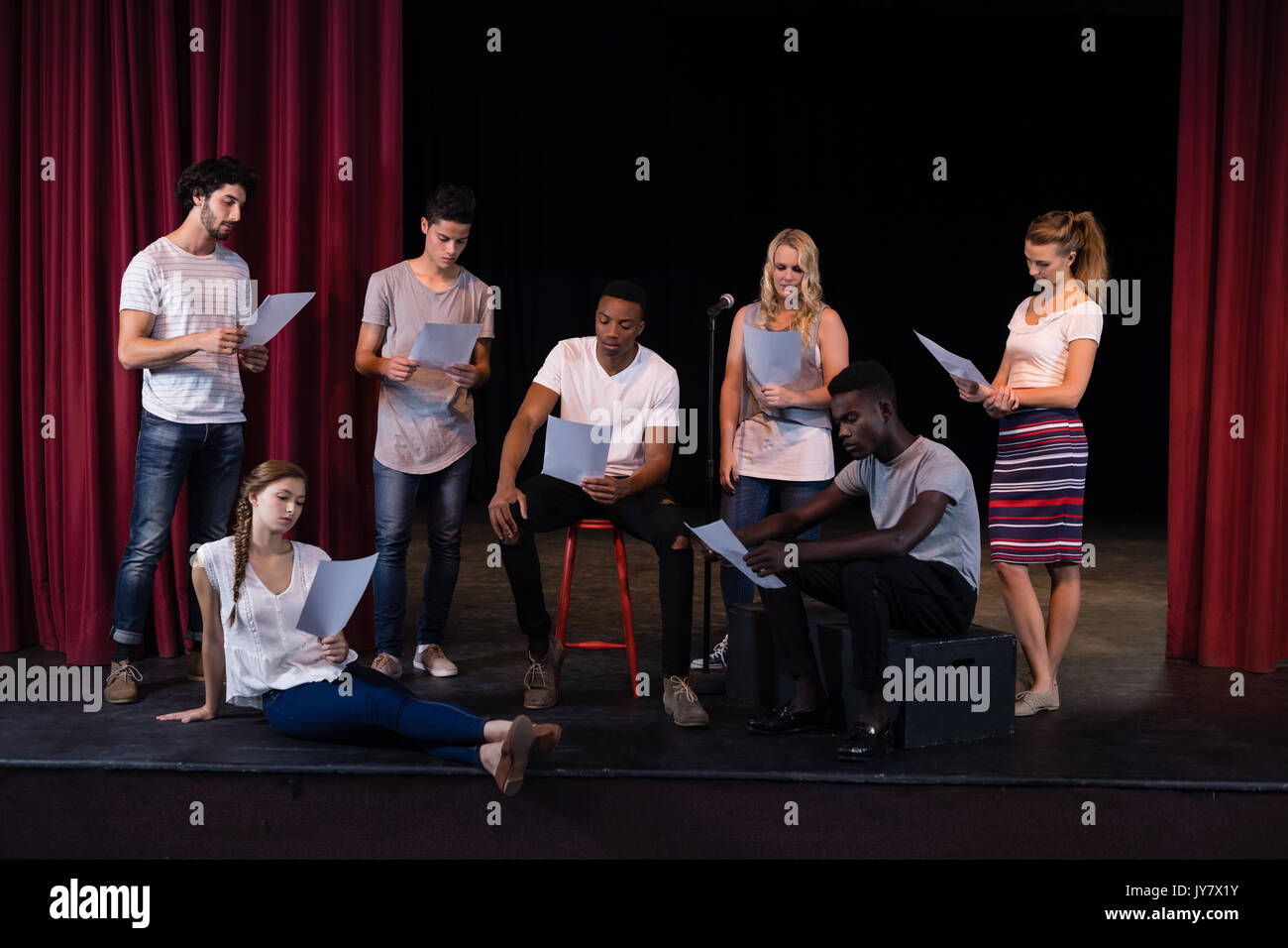 Actors reading their scripts on stage in theatre Stock Photo - Alamy