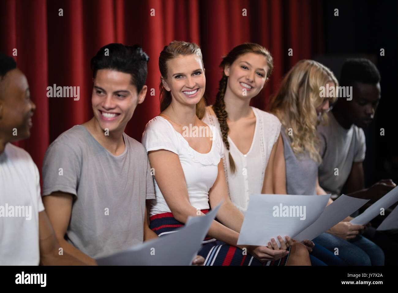 Actors reading their scripts on stage in theatre Stock Photo - Alamy