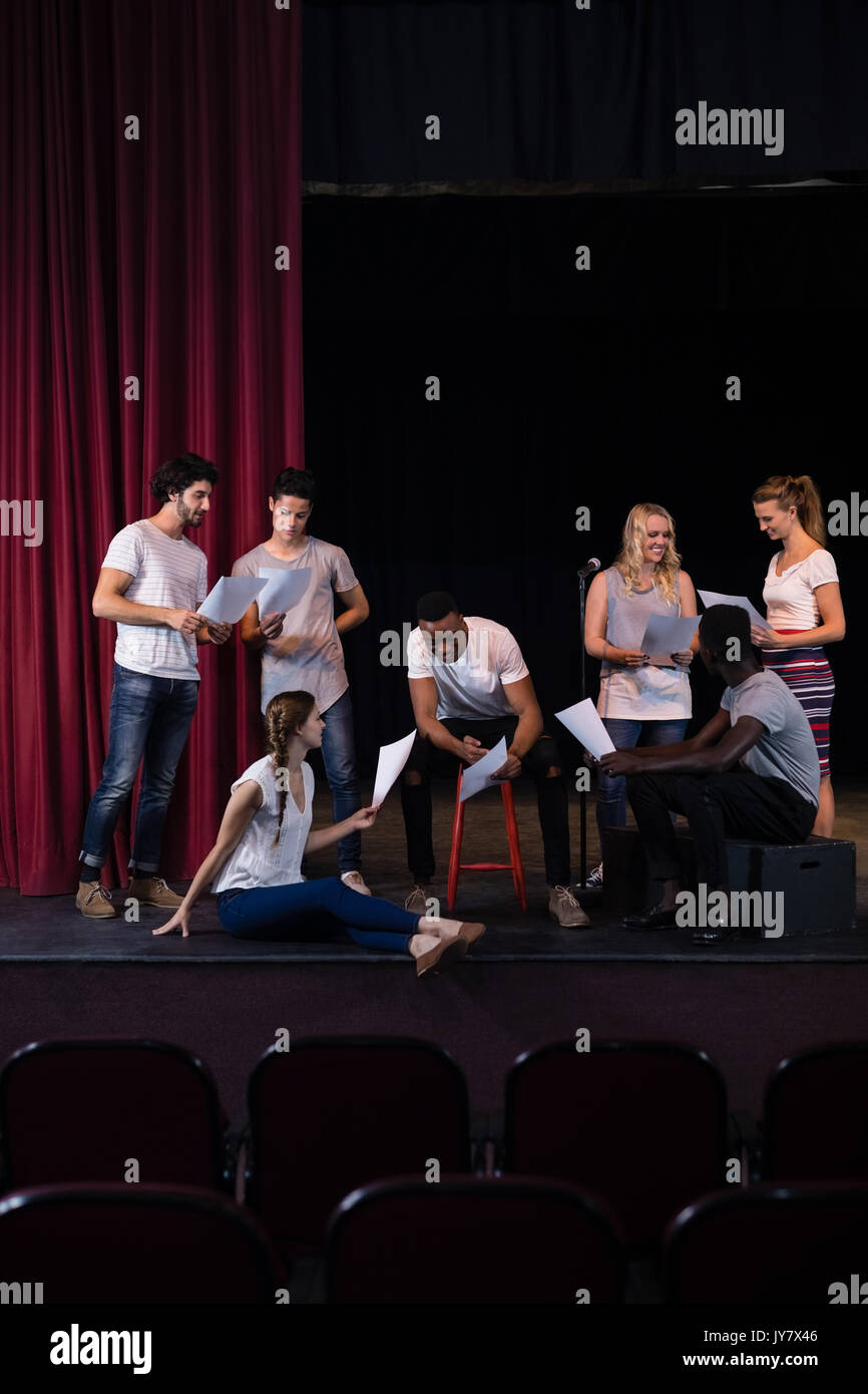Actors reading their scripts on stage in theatre Stock Photo - Alamy