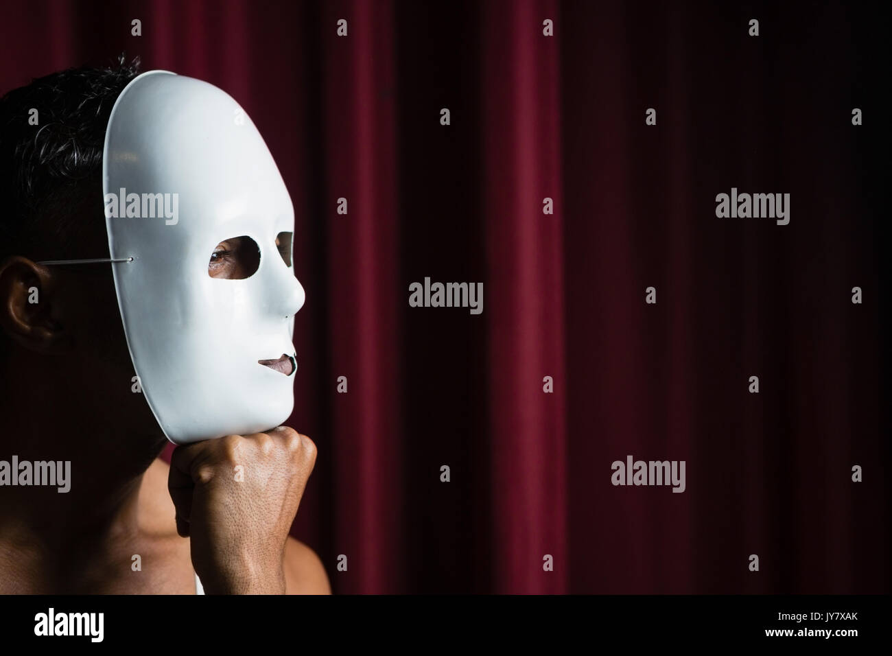 Artist wearing white mask on his face in stage Stock Photo - Alamy