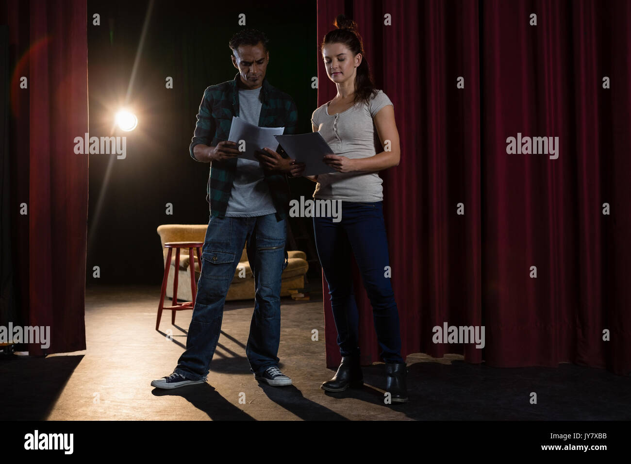 Actors reading their scripts on stage in theatre Stock Photo - Alamy