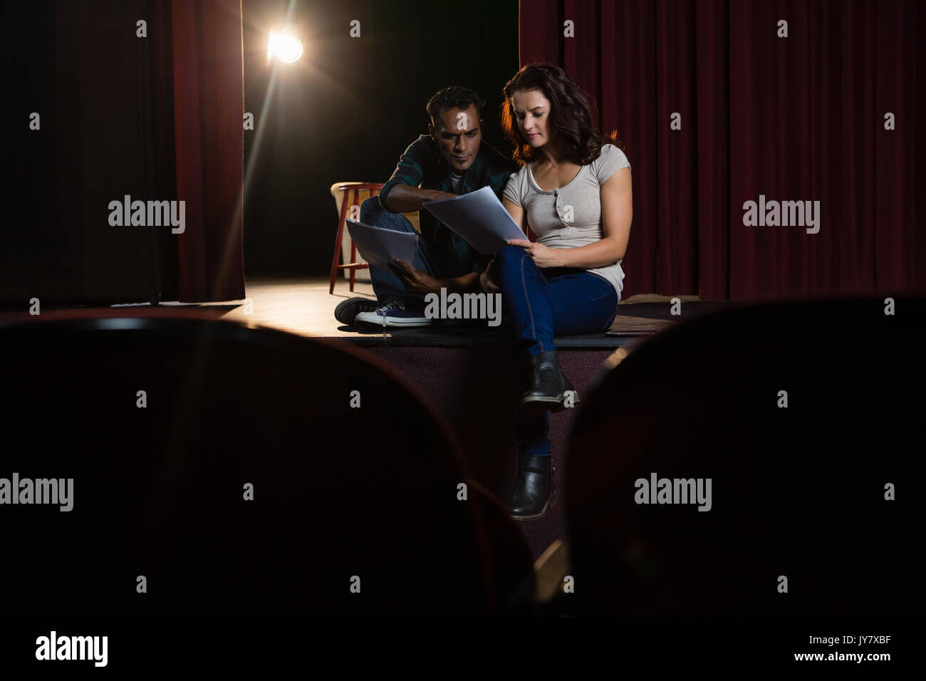 Actors reading their scripts on stage in theatre Stock Photo - Alamy