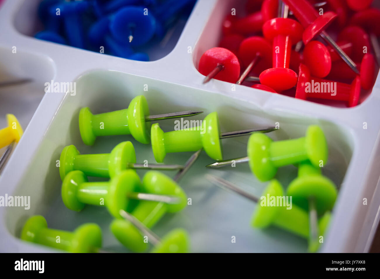Close up of colorful paper pins in container Stock Photo - Alamy