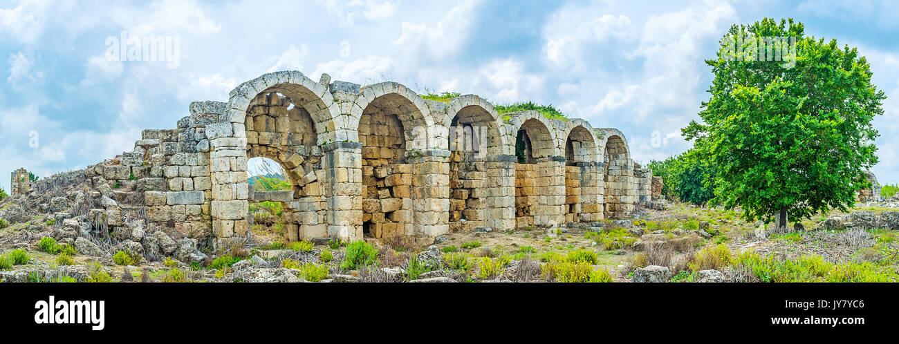 The ruins of ancient aqueduct in Perge archaeological site, one of the ...