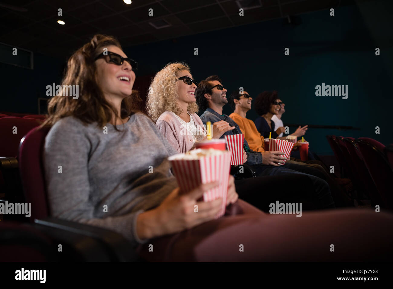 Group of people watching movie in theatre Stock Photo - Alamy