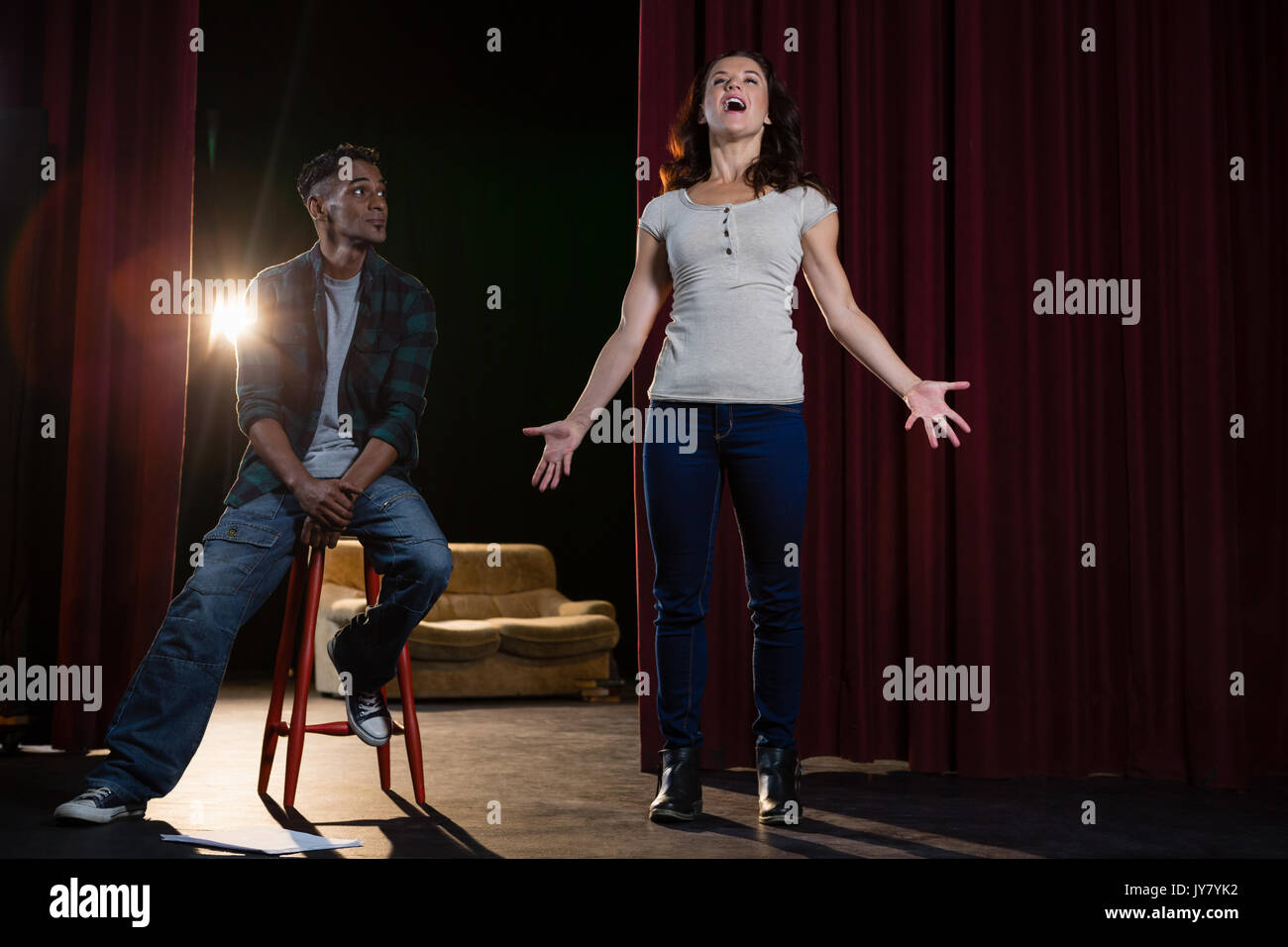 Artists rehearsing on stage in theatre Stock Photo - Alamy