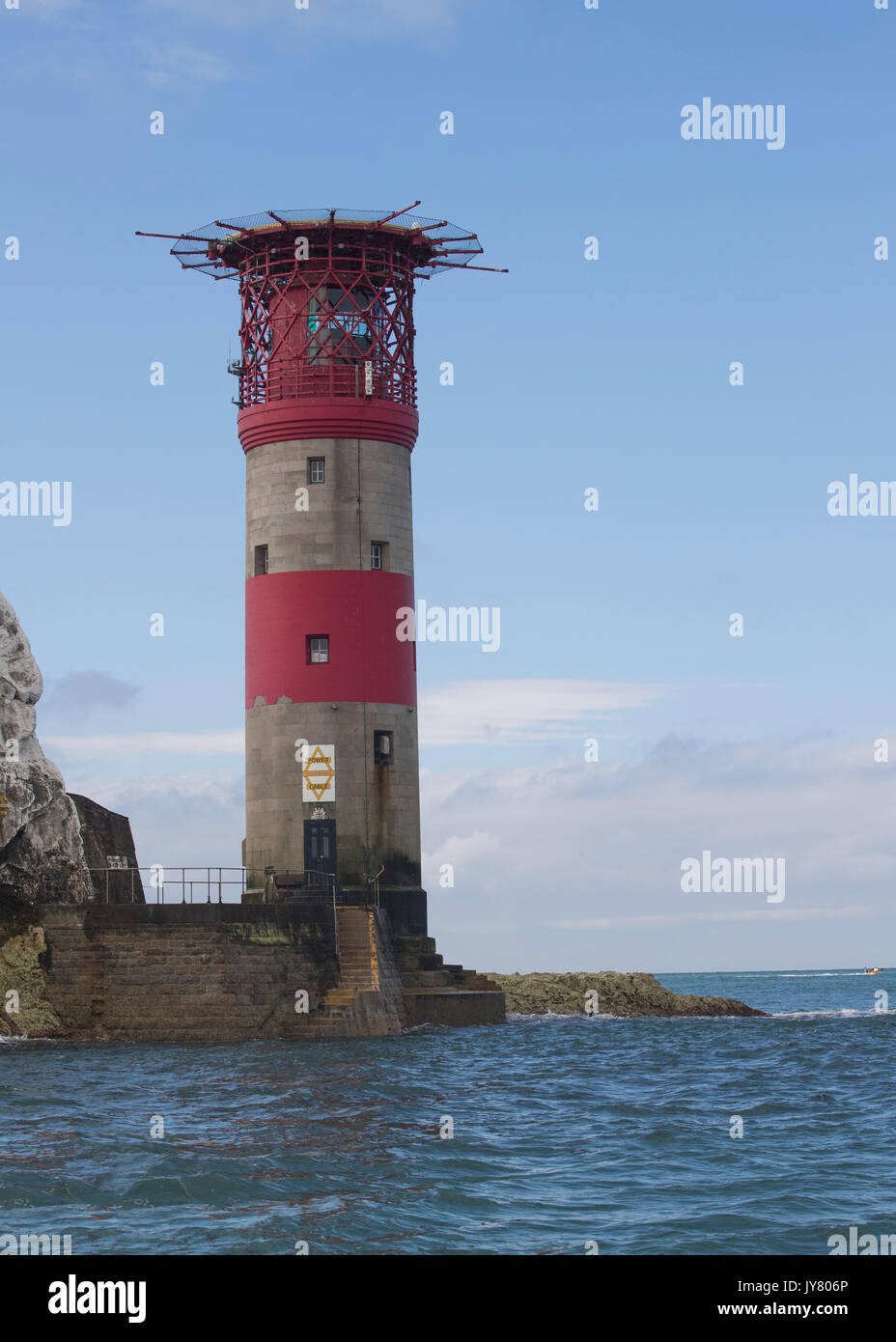 The Needles rocks and lighthouse at the westernmost tip of the Isle of ...