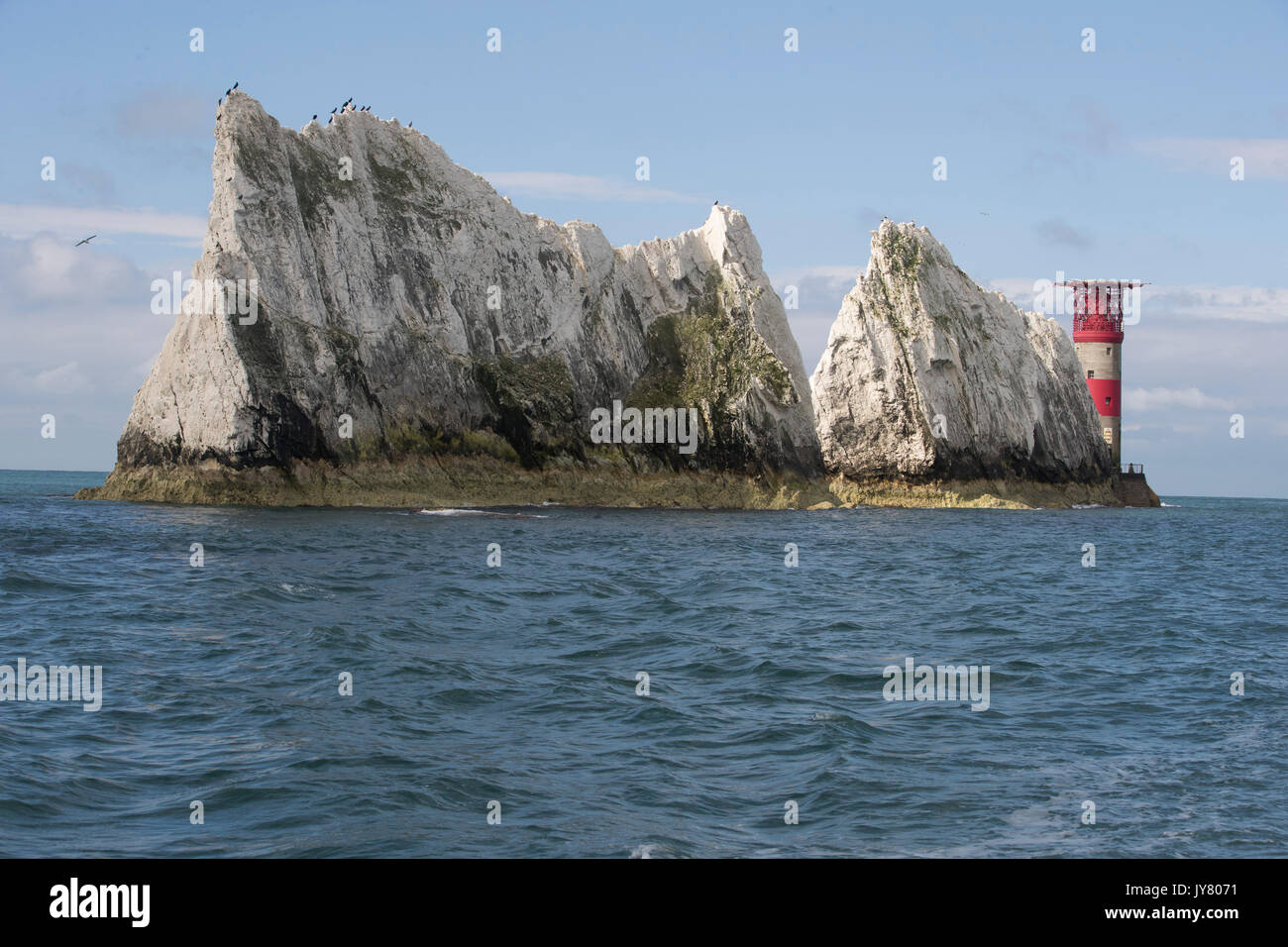 The Needles rocks and lighthouse at the westernmost tip of the Isle of ...