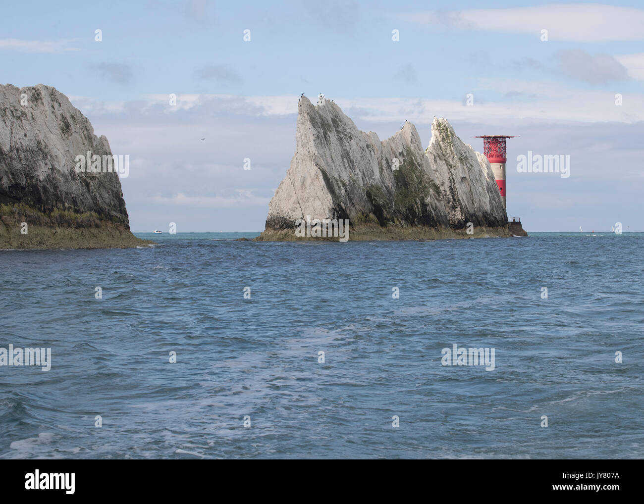 The Needles rocks and lighthouse at the westernmost tip of the Isle of ...