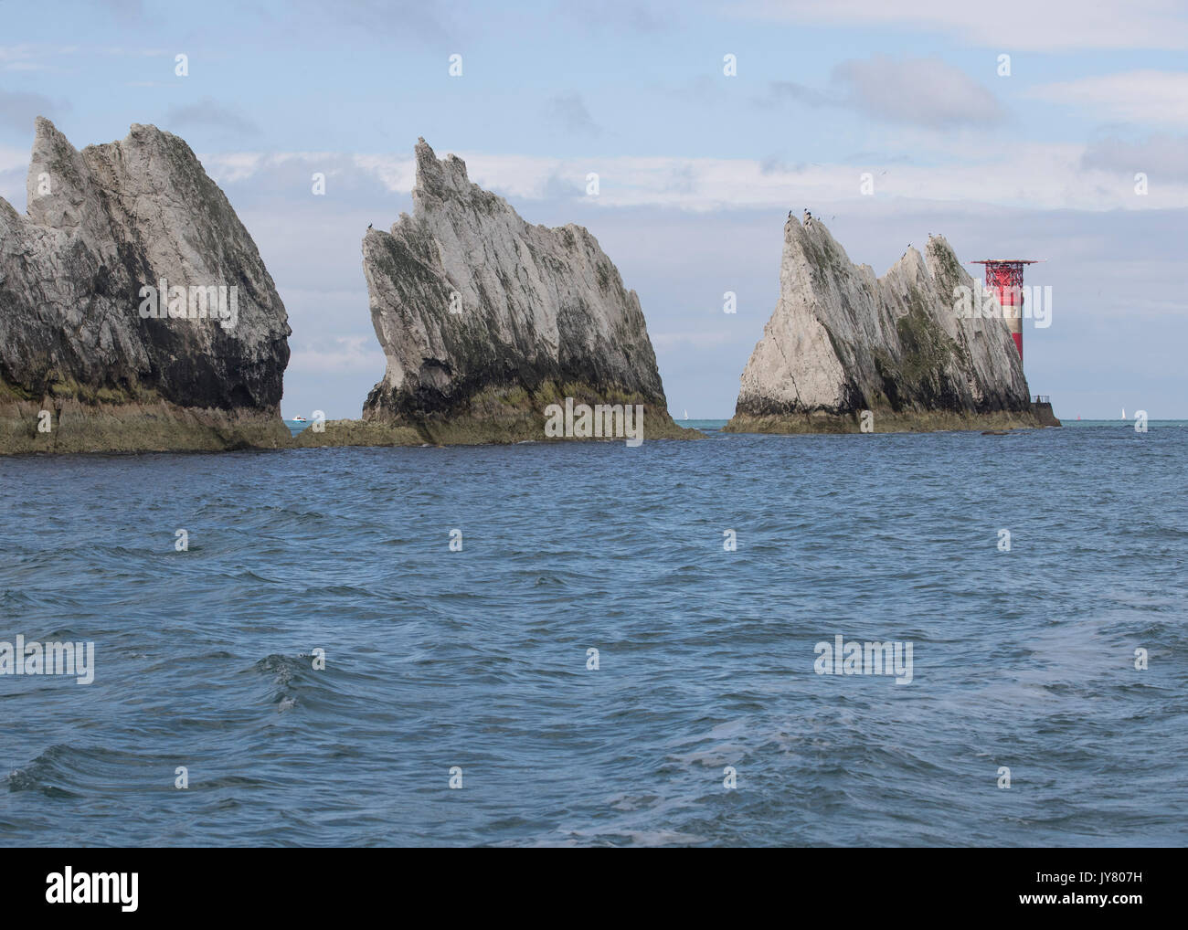 The Needles rocks and lighthouse at the westernmost tip of the Isle of ...