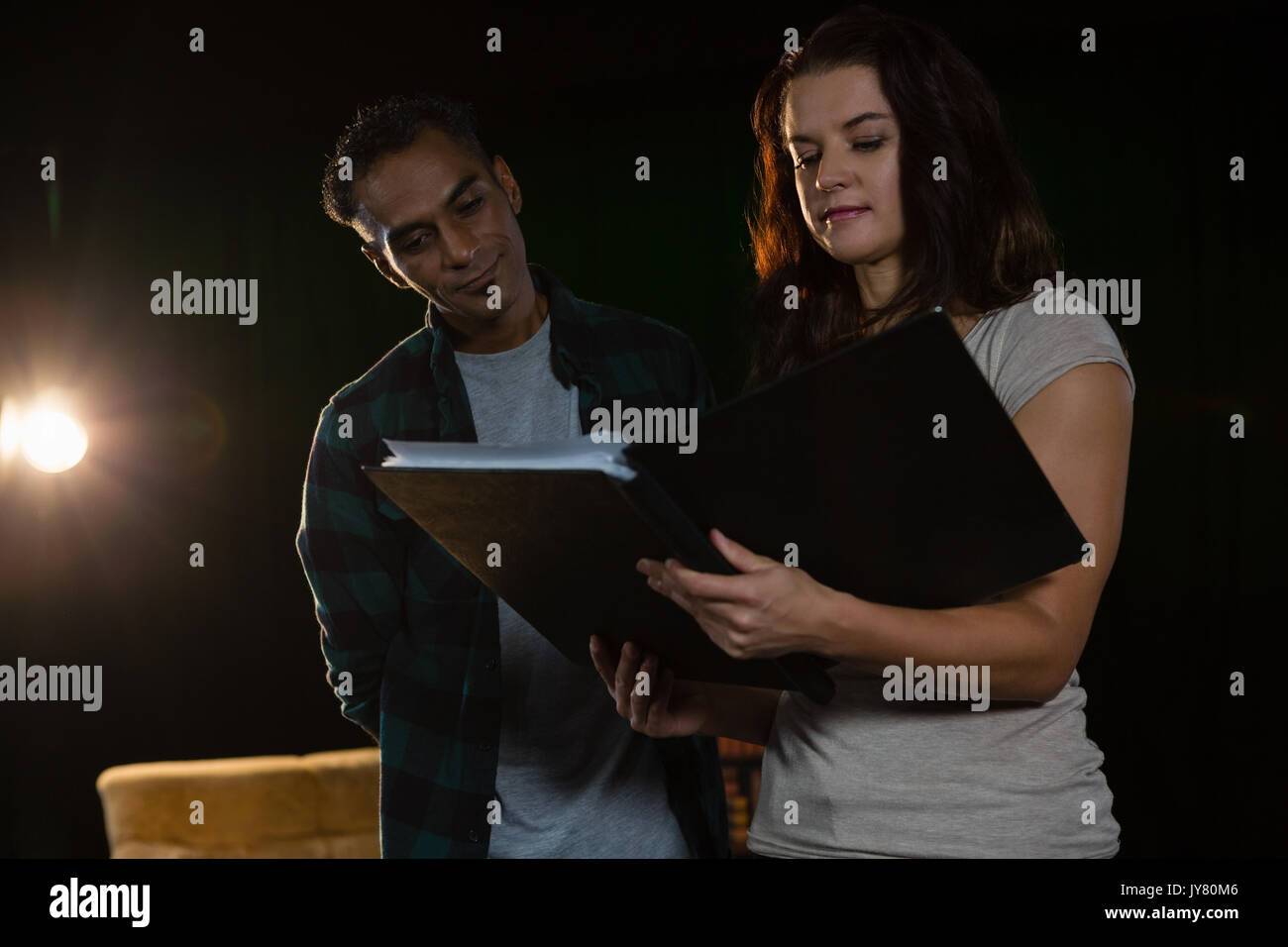 Actors reading their scripts on stage in theatre Stock Photo - Alamy