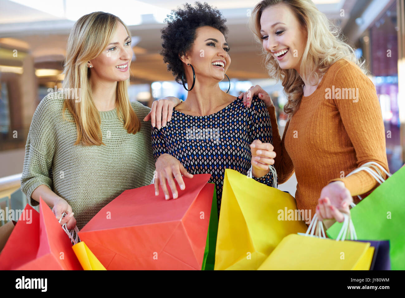 Successful shopping with the best friends Stock Photo - Alamy
