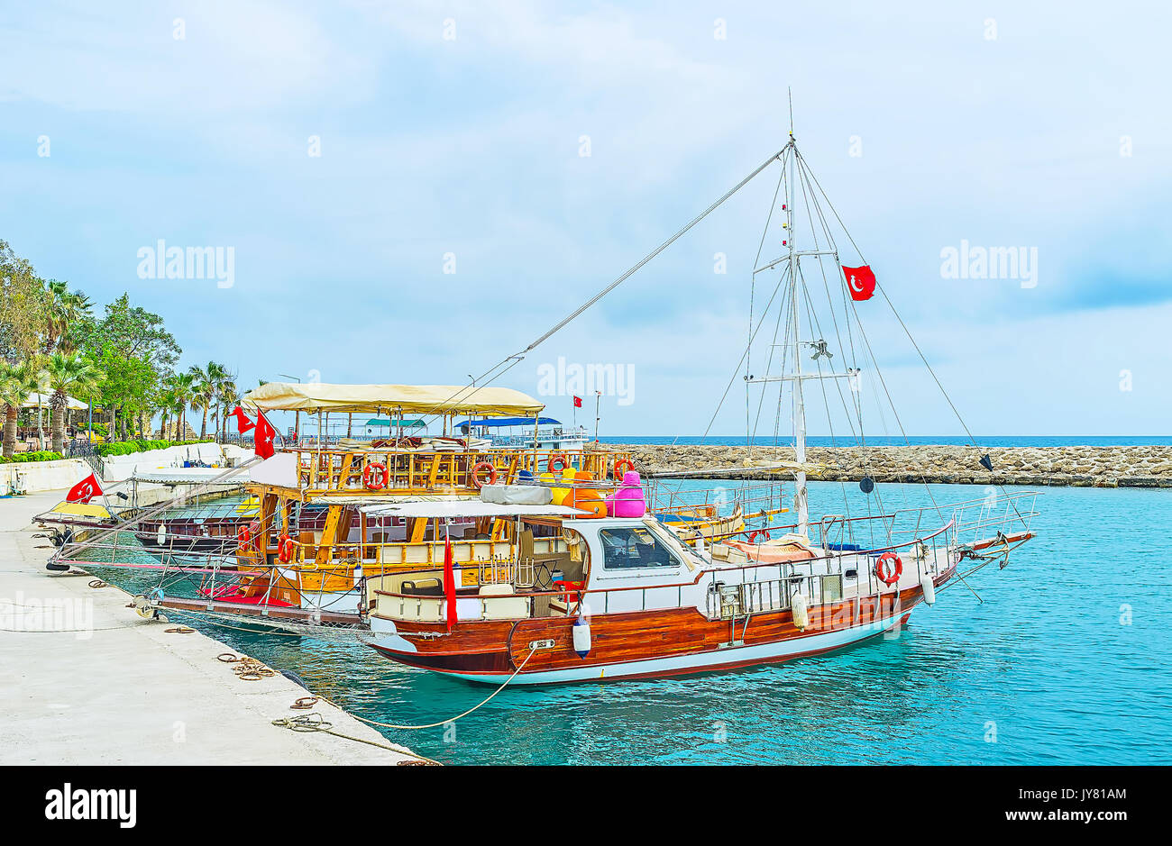 The seaside promenade opens the view on row of yachts and pleasure ...