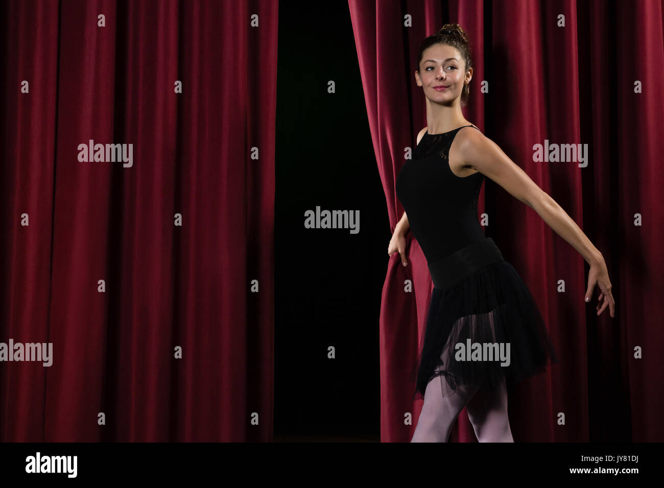 Ballerina performing ballet dance on stage in theatre Stock Photo - Alamy