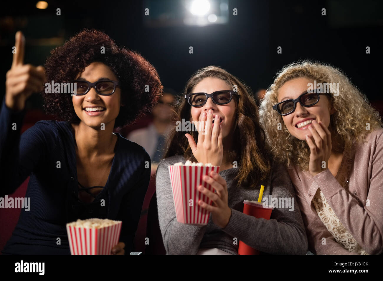 Group of people watching movie in theatre Stock Photo - Alamy