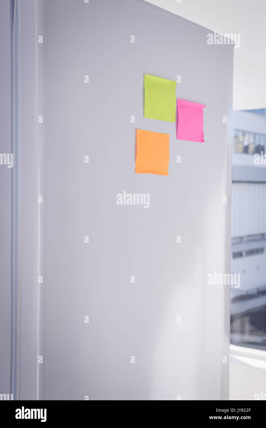 Post it notes stuck on refrigerator Stock Photo - Alamy
