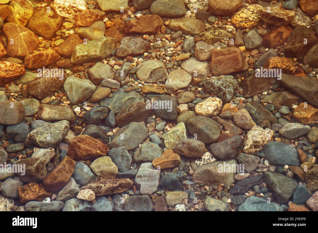 Background of water and stone. Colorful round stones under water Stock ...