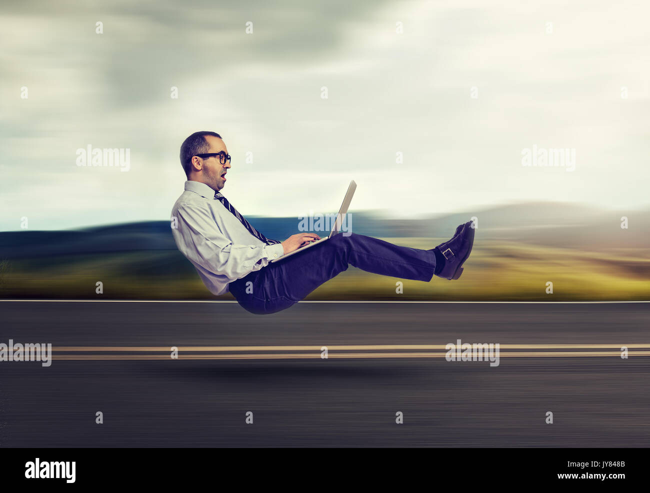 Using computer at side of road hi-res stock photography and images - Alamy