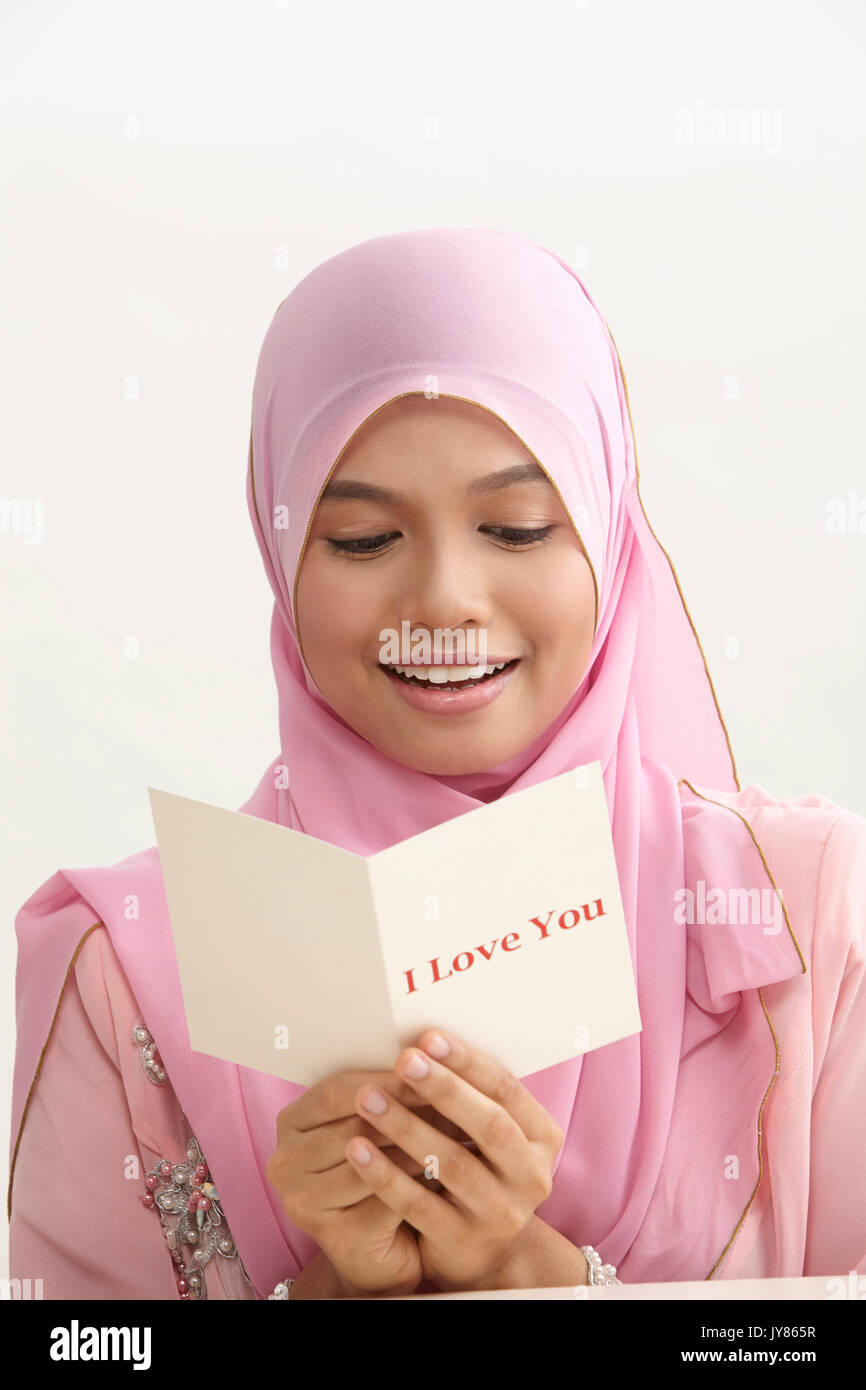 malay woman with tudung holding i love you greeting card Stock Photo - Alamy