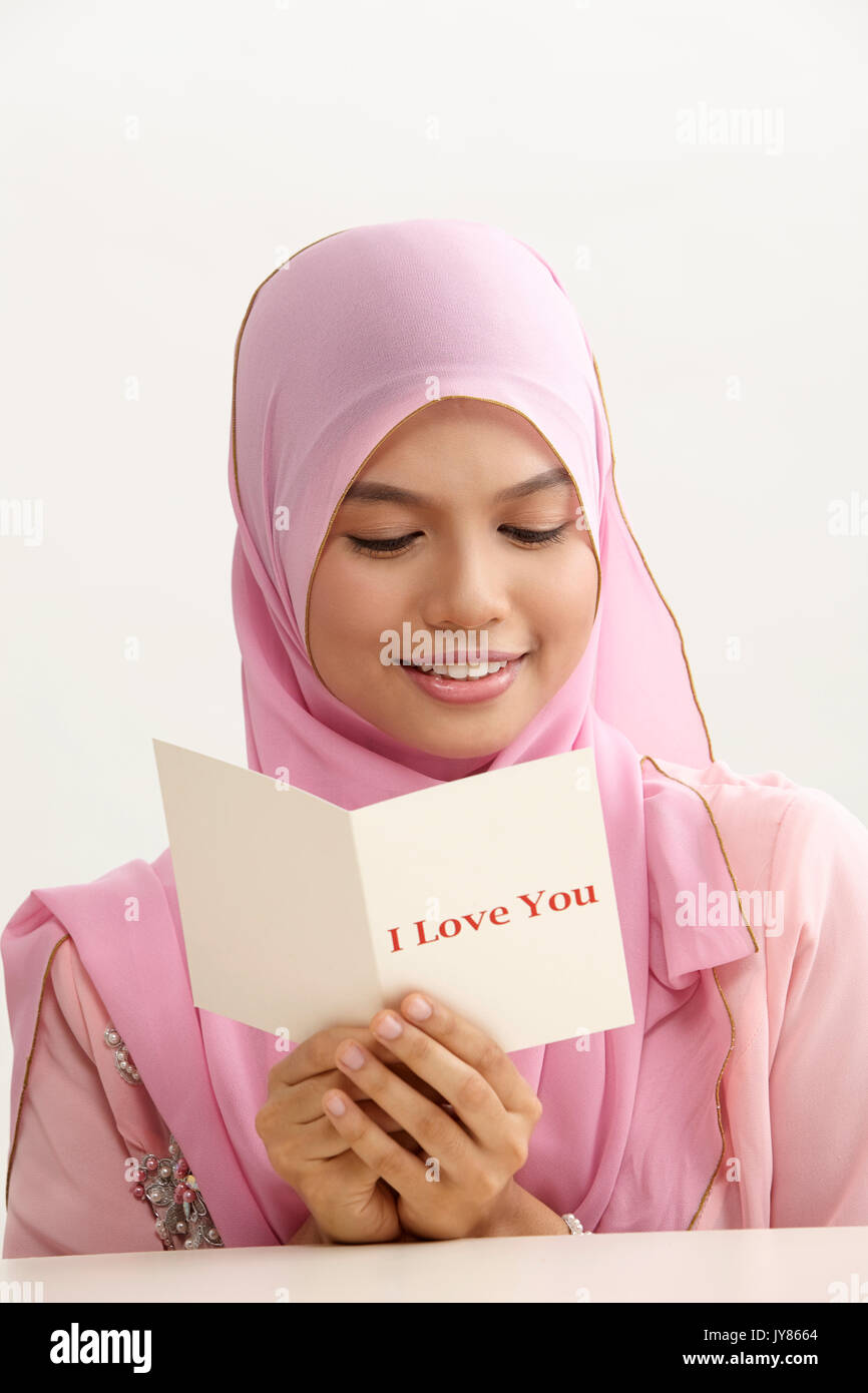 malay woman with tudung holding i love you greeting card Stock Photo - Alamy