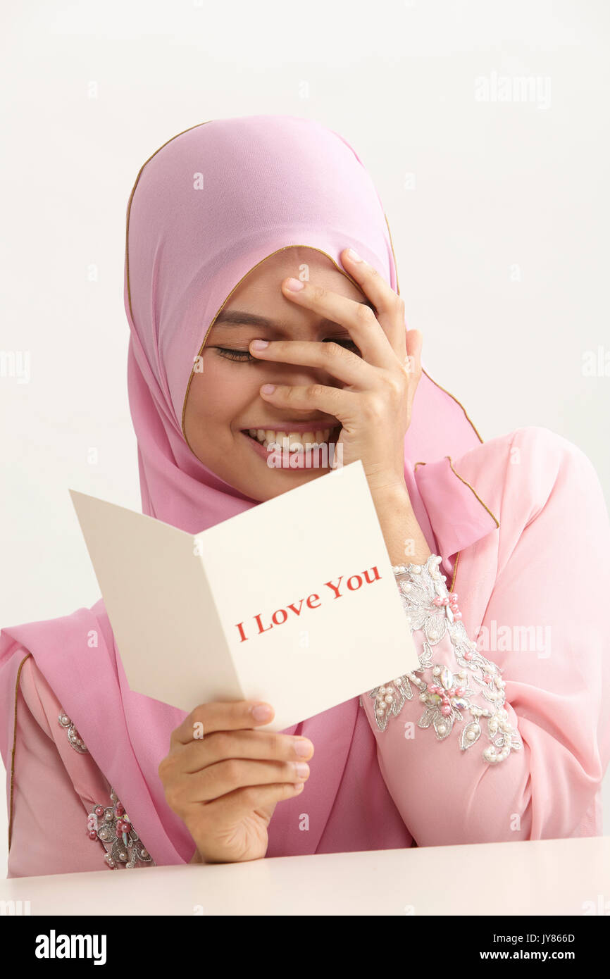 malay woman with tudung holding i love you greeting card Stock Photo - Alamy