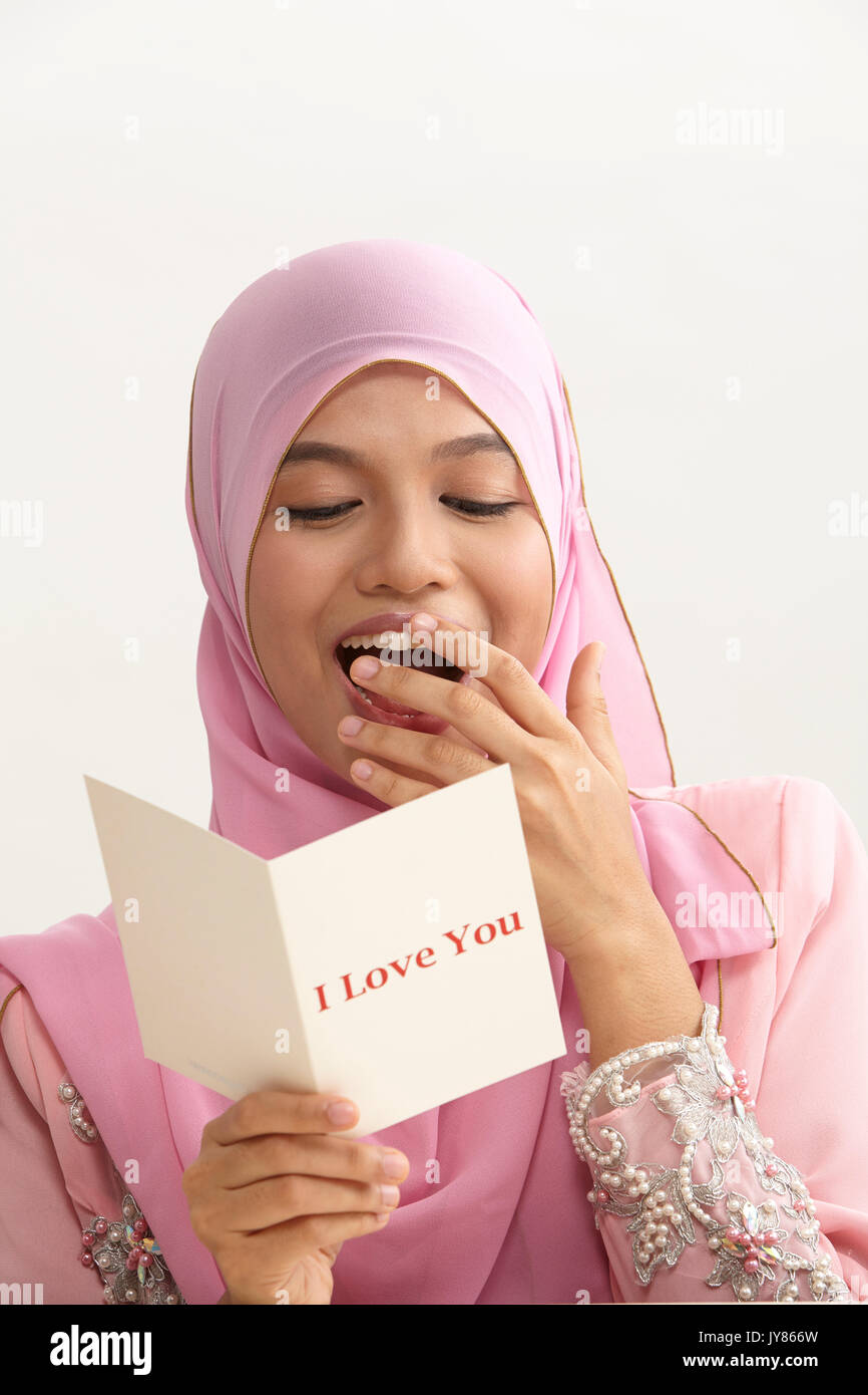 malay woman with tudung holding i love you greeting card Stock Photo - Alamy