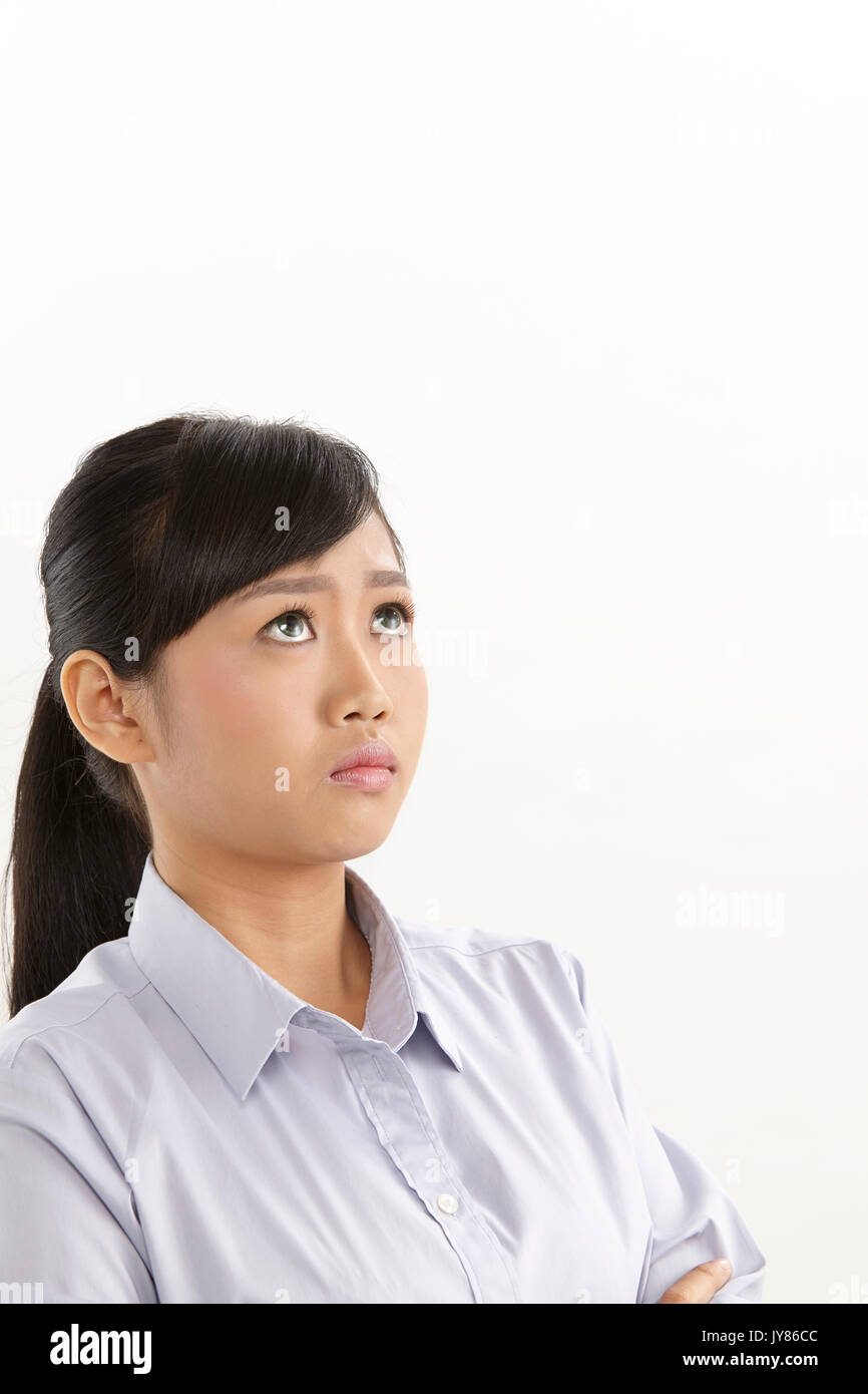 asian thoughtful woman on the white background Stock Photo - Alamy