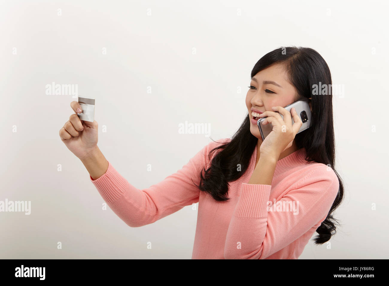 asian woman make payment using smart phone Stock Photo - Alamy