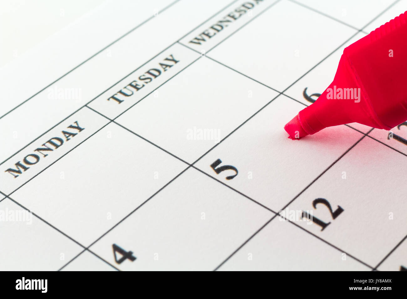 Calendar with red marker Stock Photo - Alamy