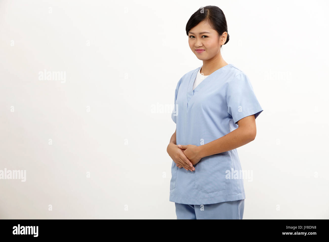 female nurse with blue uniform on the white background Stock Photo - Alamy