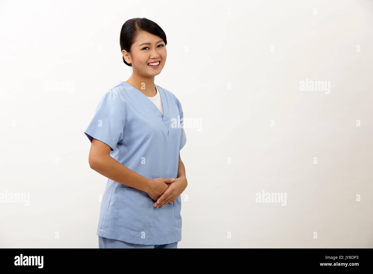 female nurse with blue uniform on the white background Stock Photo - Alamy