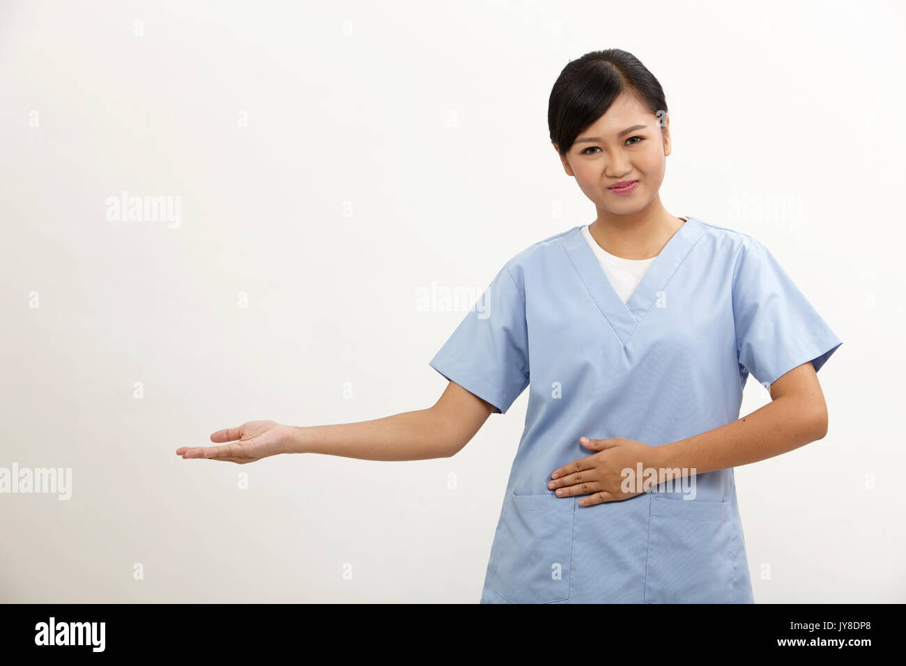 female nurse with blue uniform on the white background Stock Photo - Alamy