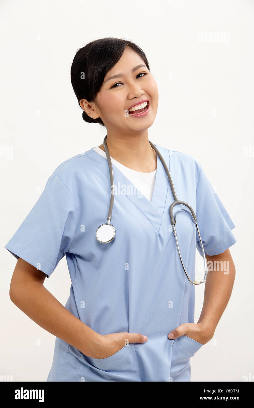 female nurse with blue uniform on the white background Stock Photo - Alamy