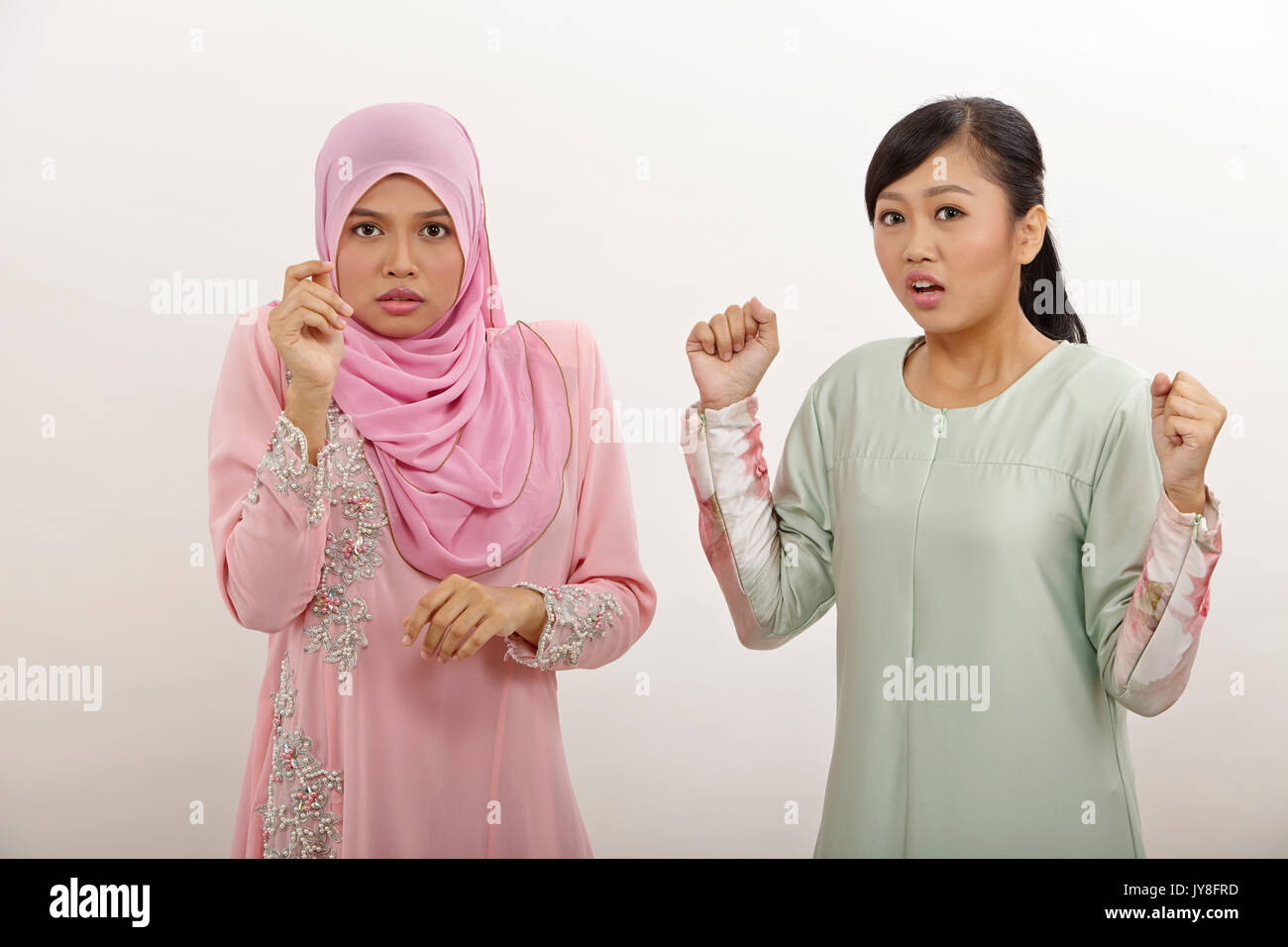 two malay women with scared expression Stock Photo - Alamy